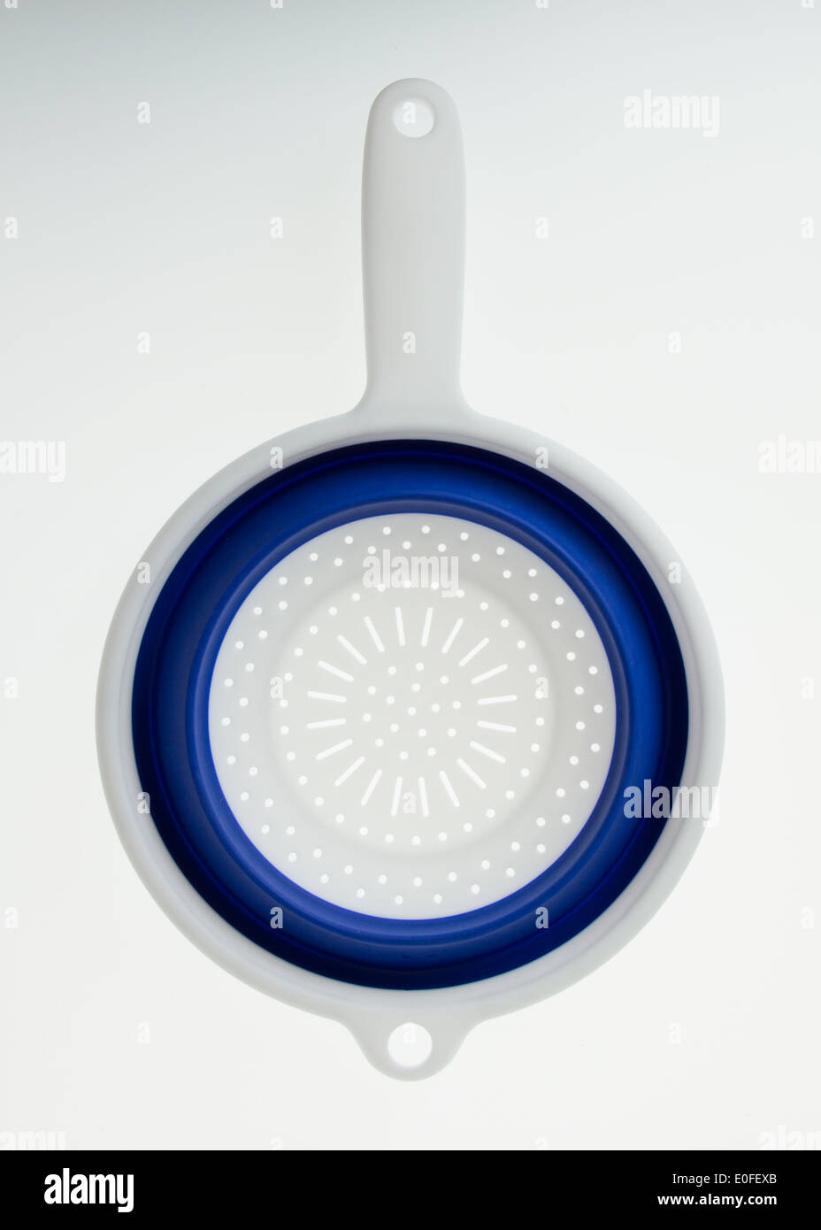 Blue plastic sieve with handle hi-res stock photography and images - Alamy