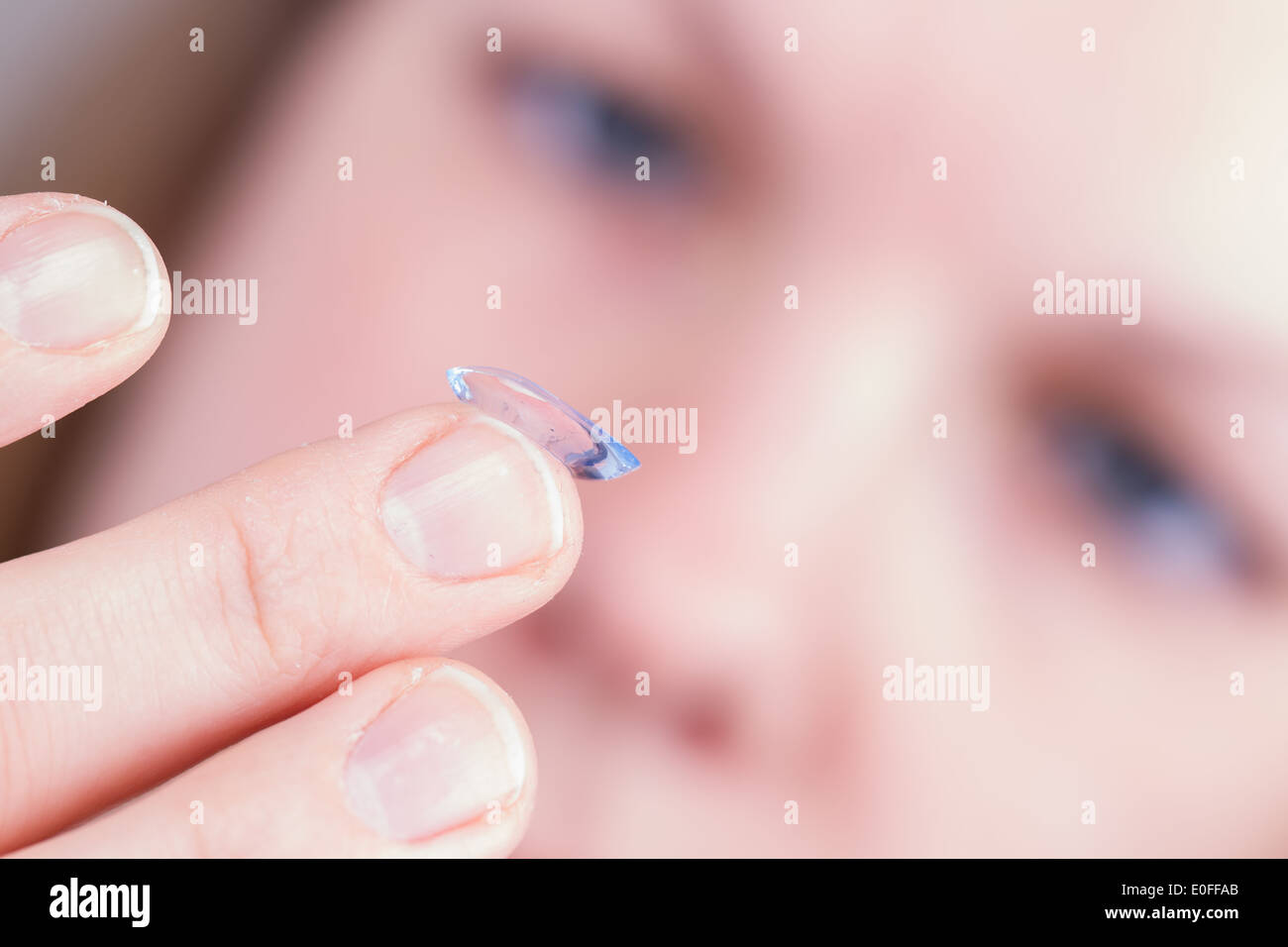 Close up of inserting a contact lens in female eye Stock Photo - Alamy