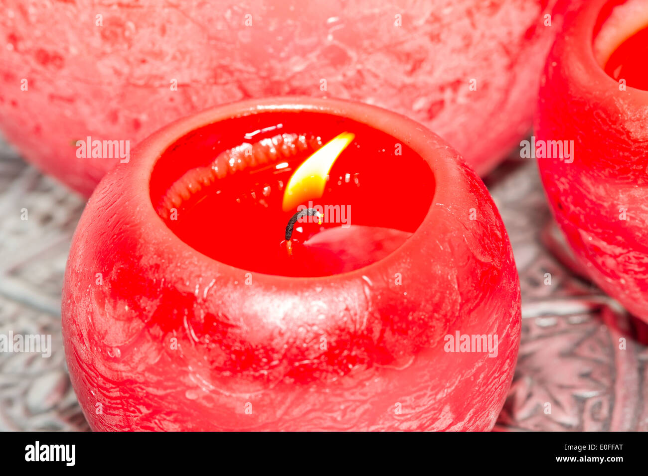Close-up of a red candle, bright flame Stock Photo - Alamy