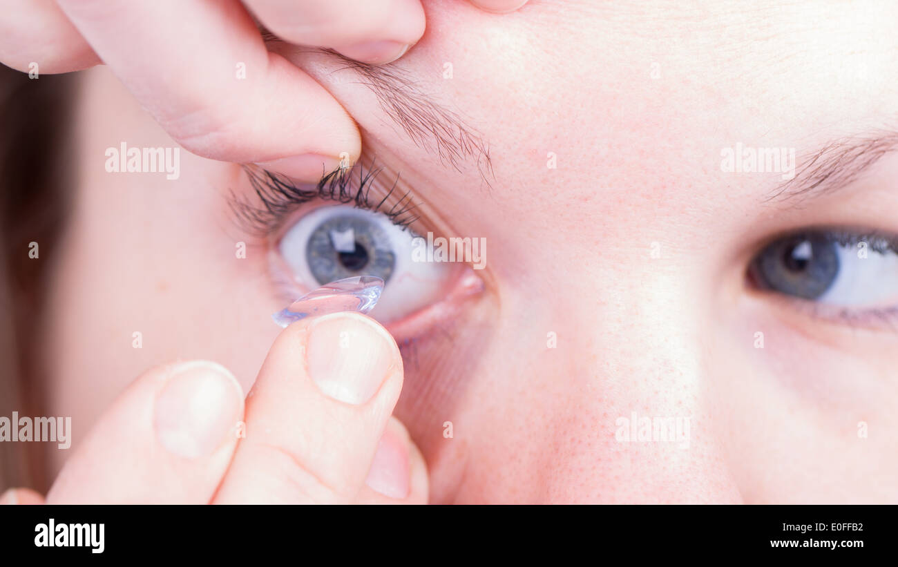 Close up of inserting a contact lens in female eye Stock Photo - Alamy