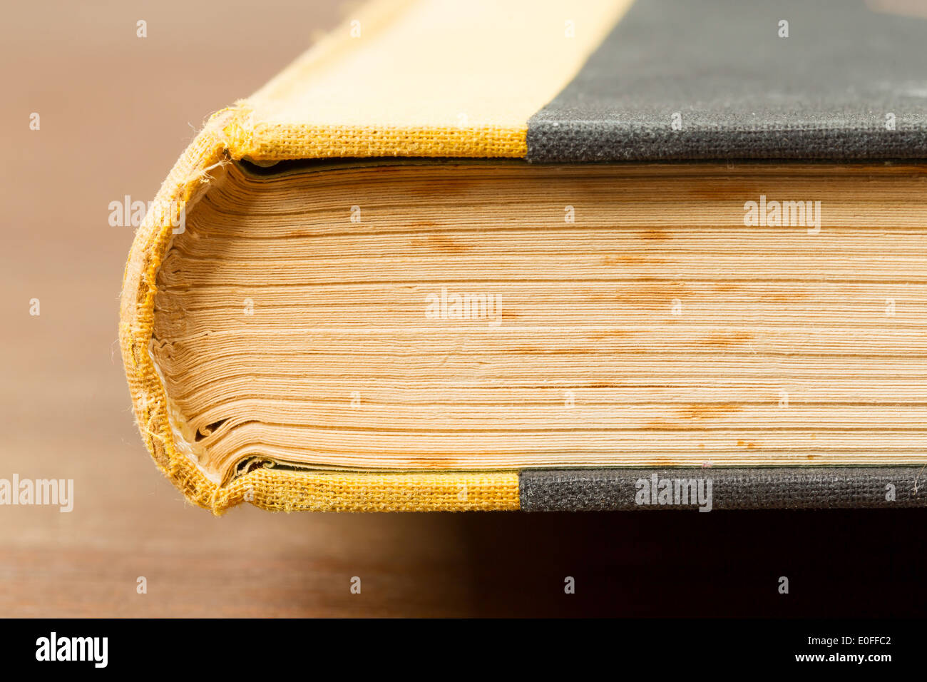 Close-up of an old book on a wooden table Stock Photo - Alamy