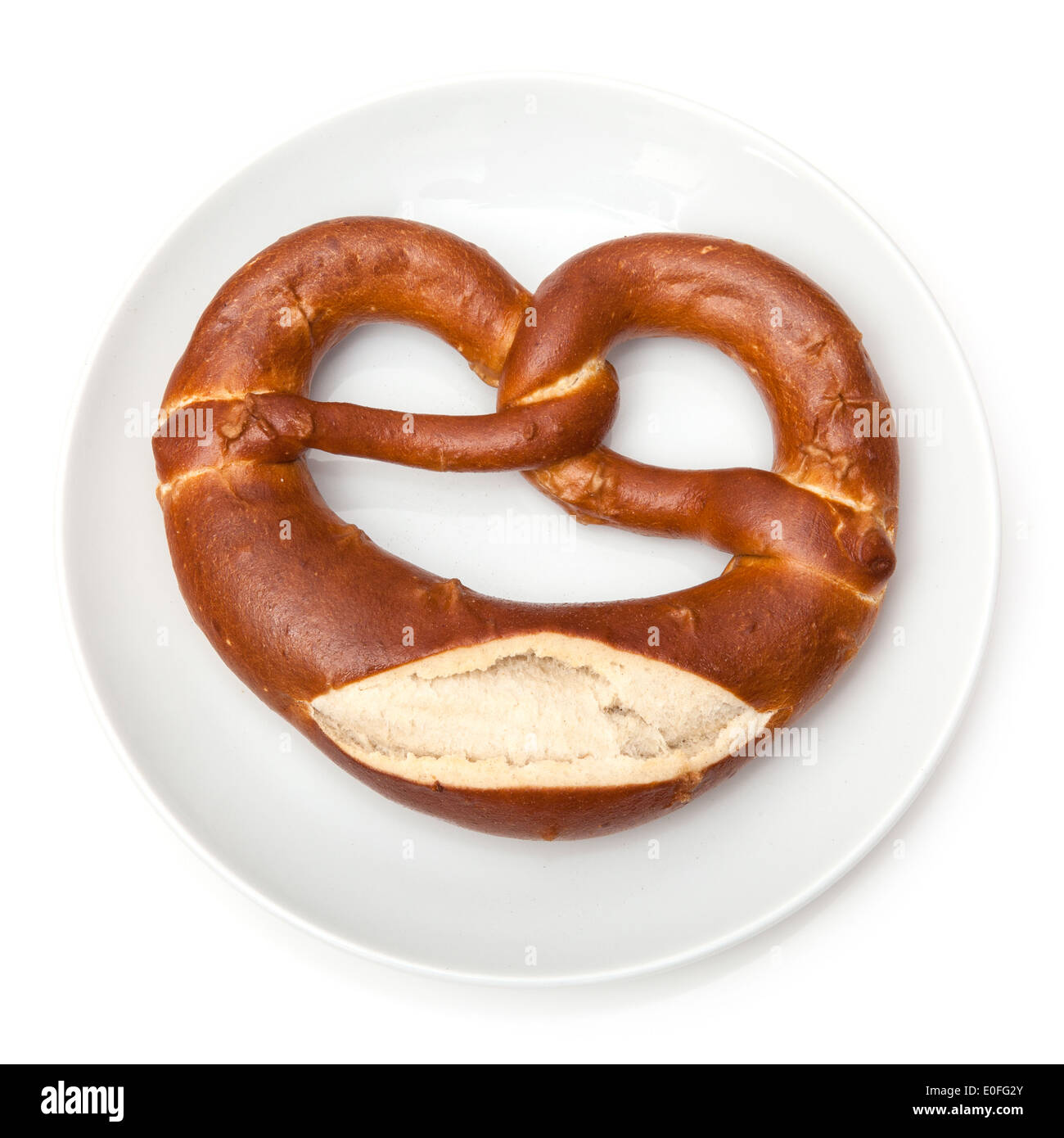 Traditional German Pretzel on a white plate Stock Photo - Alamy