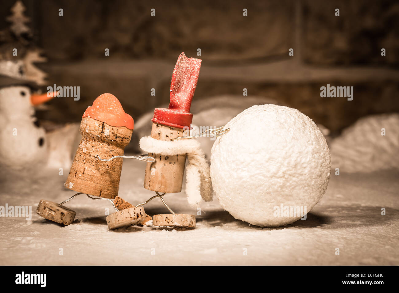 Concept Teamwork Snowball rolling, wine cork figures Stock Photo - Alamy