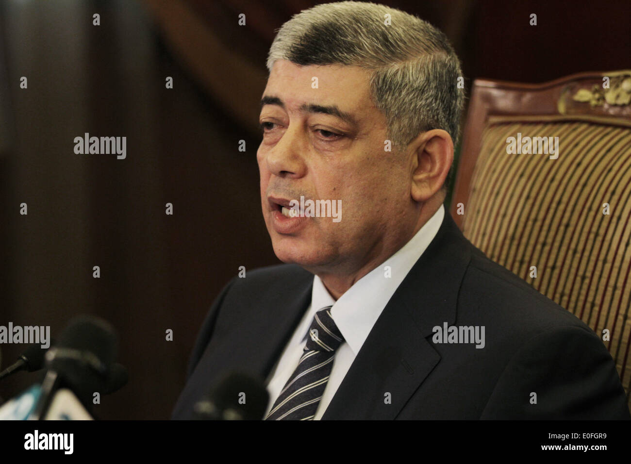 Cairo, Egypt. 12th May, 2014. Egyptian Interior Minister Mohamed Ibrahim, speaks during a press ...