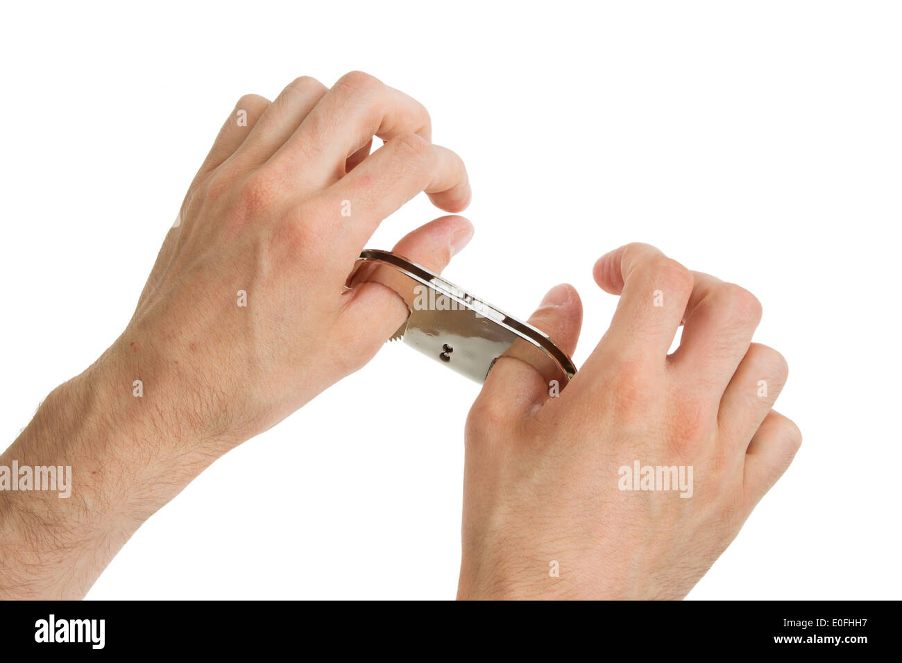 Adult hands in thumb cuffs isolated on a white background Stock Photo ...