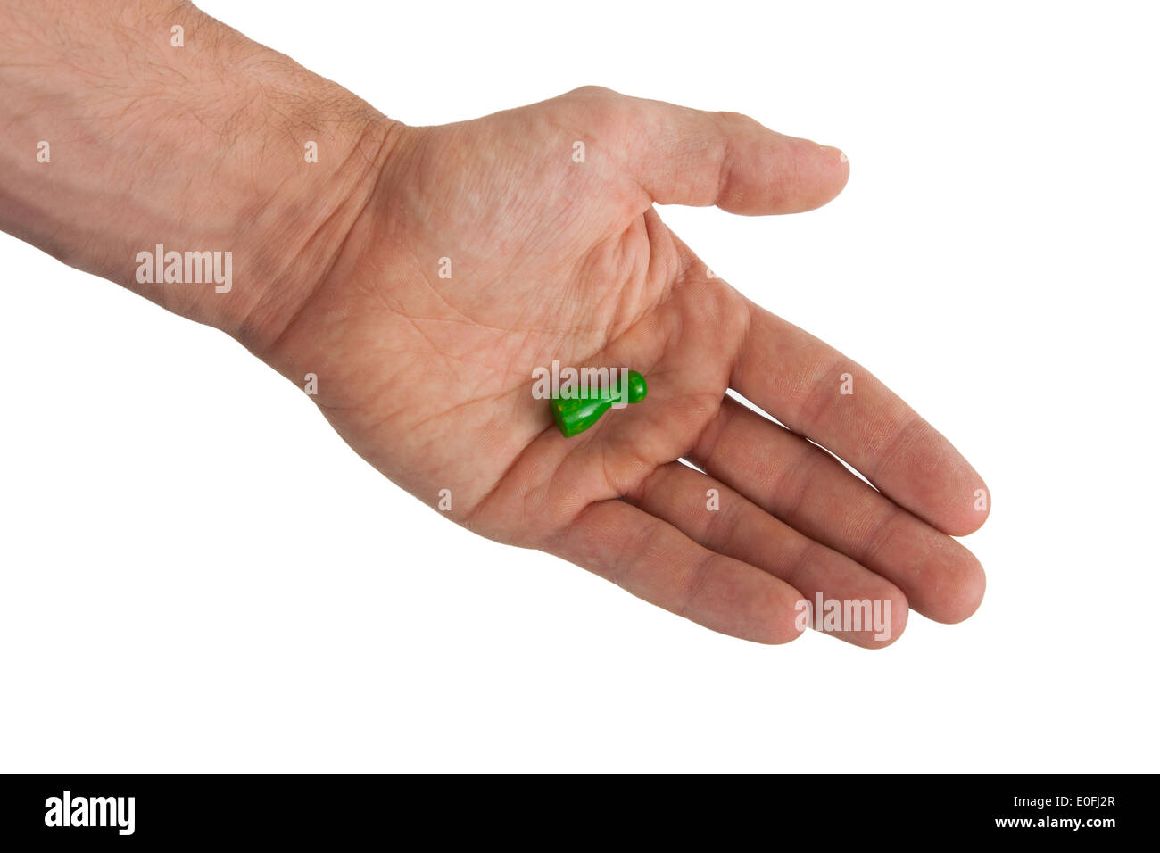Hand holding a green pawn, isolated on white Stock Photo - Alamy