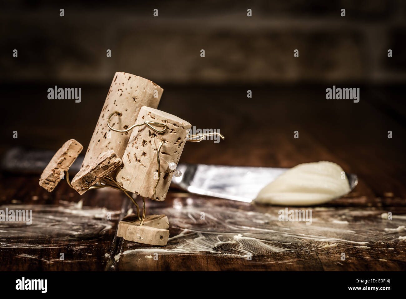 Concept couple is skating on buttered table, wine cork figures Stock ...