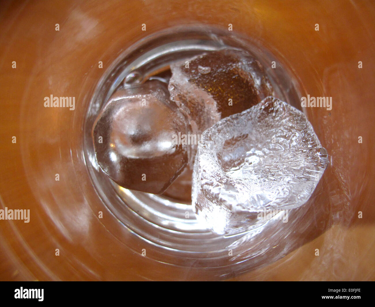 Ice cubes in glass from above Stock Photo - Alamy