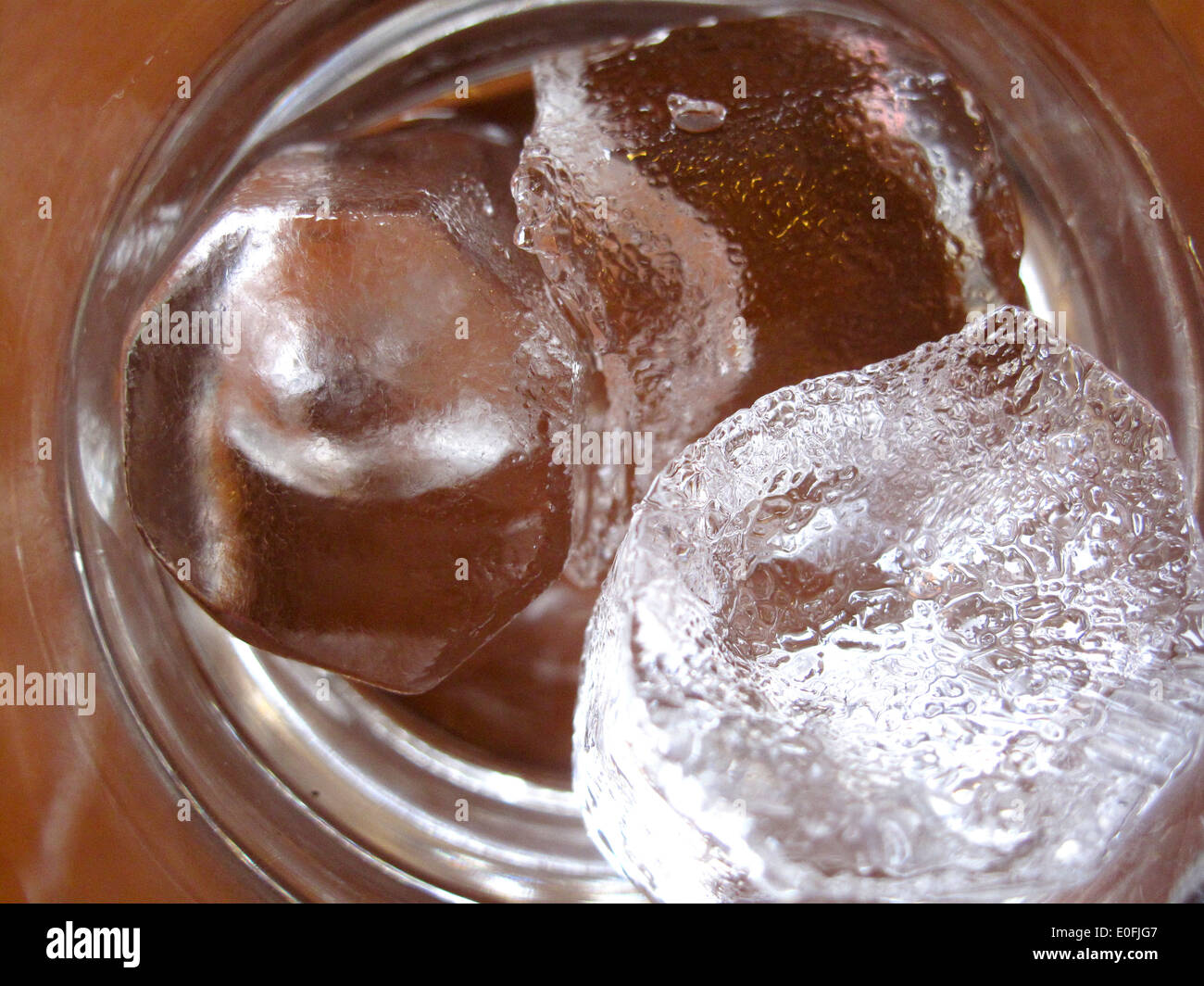 Ice cubes in glass from above Stock Photo - Alamy