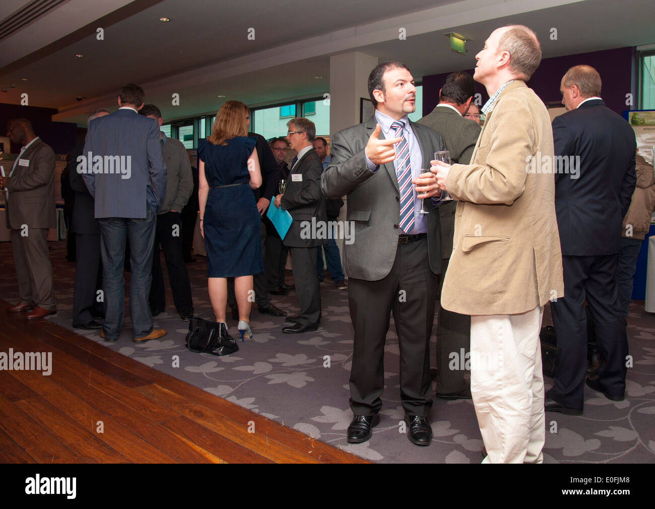 Two men talking networking at a business conference social event Stock ...