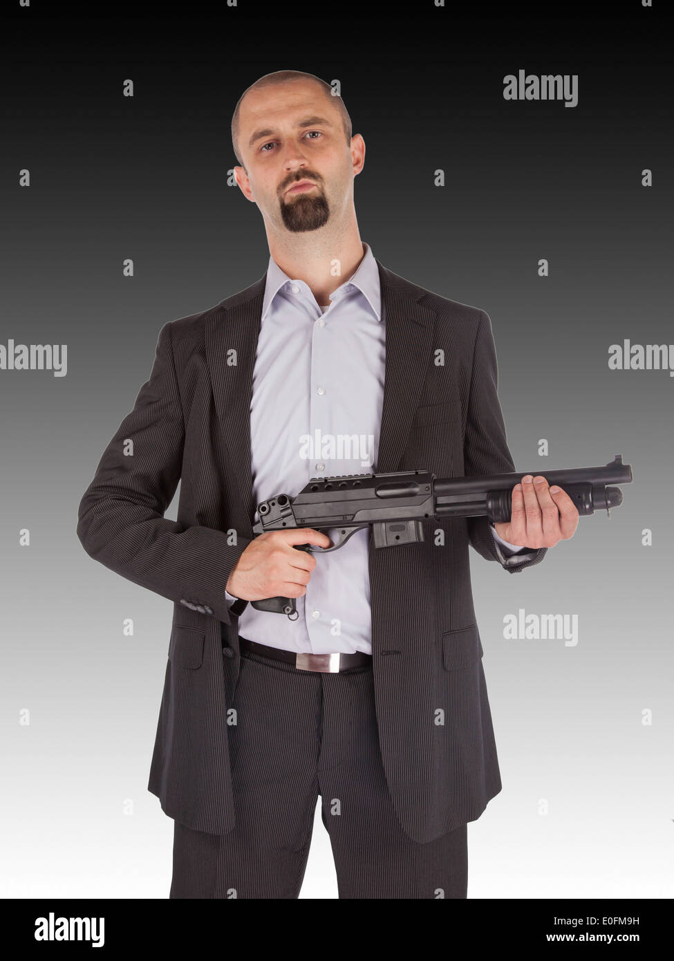 Mafia man is holding a shotgun, isolated on white Stock Photo - Alamy