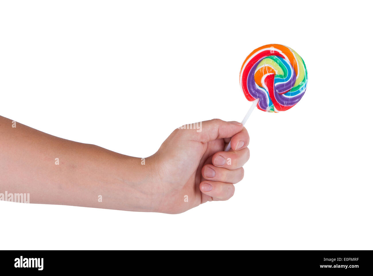 Lollipop in hand isolated on white background Stock Photo - Alamy