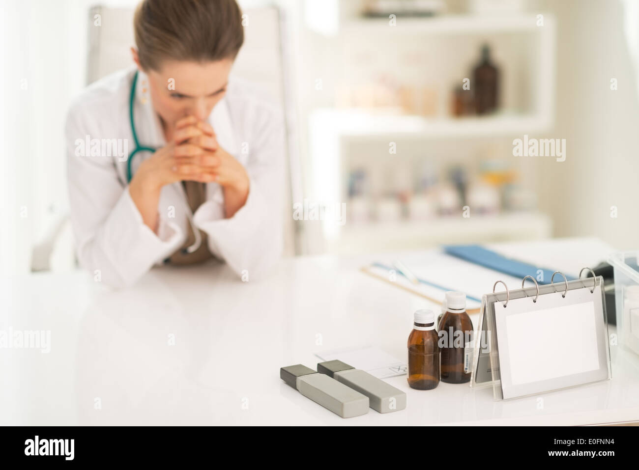 Closeup on concerned medical doctor woman sitting in office Stock Photo ...