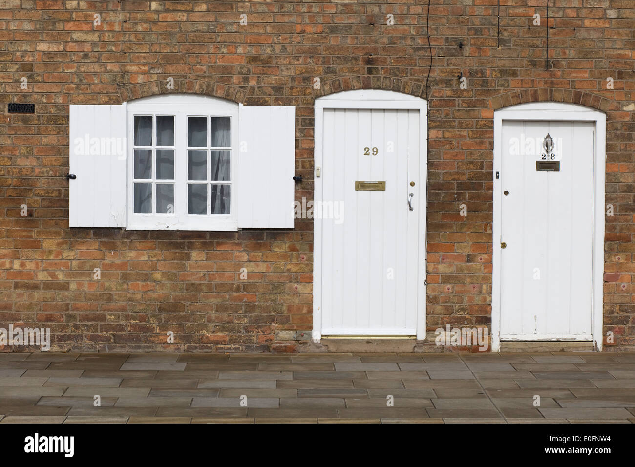 Two Closed wooden doors and a Shuttered Window Stock Photo - Alamy