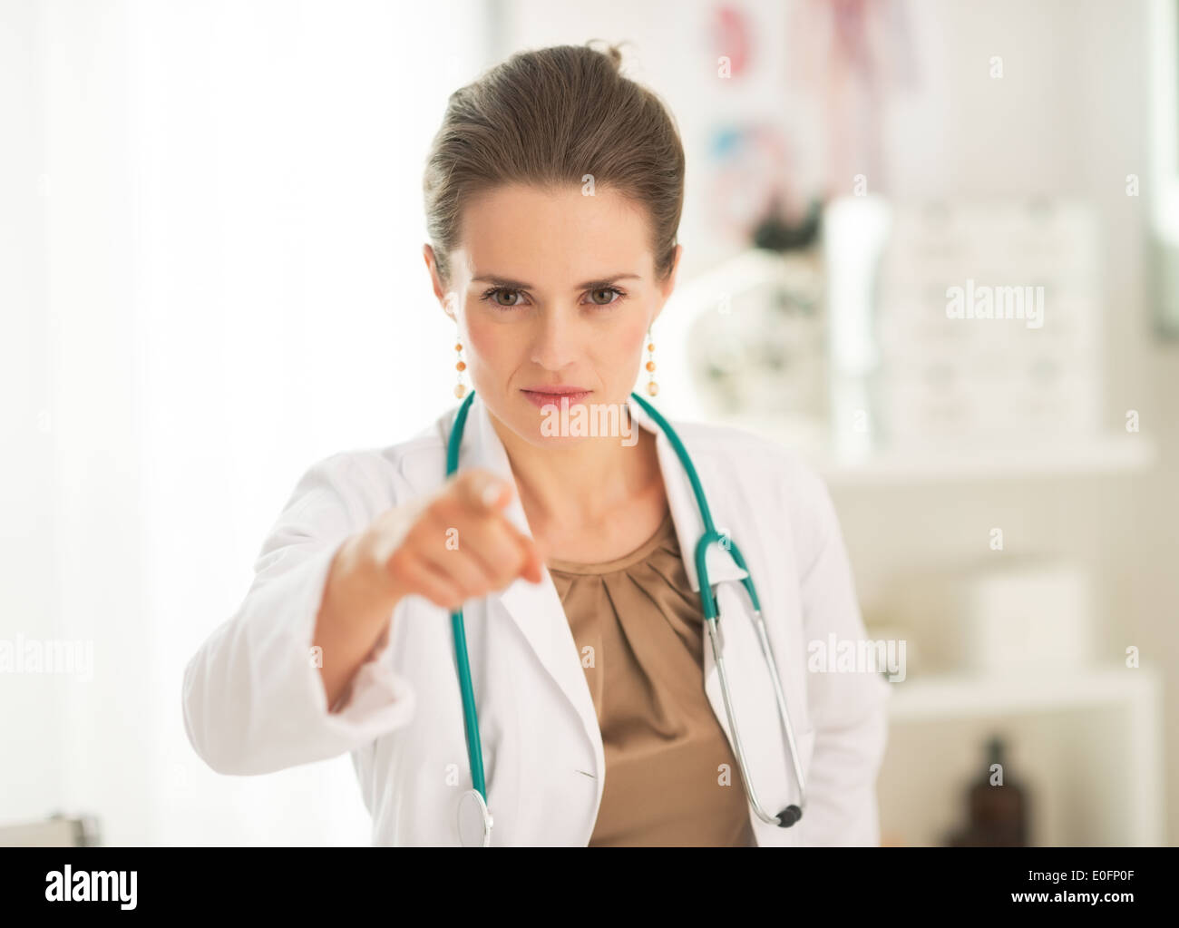 Portrait of medical doctor woman pointing in camera Stock Photo - Alamy