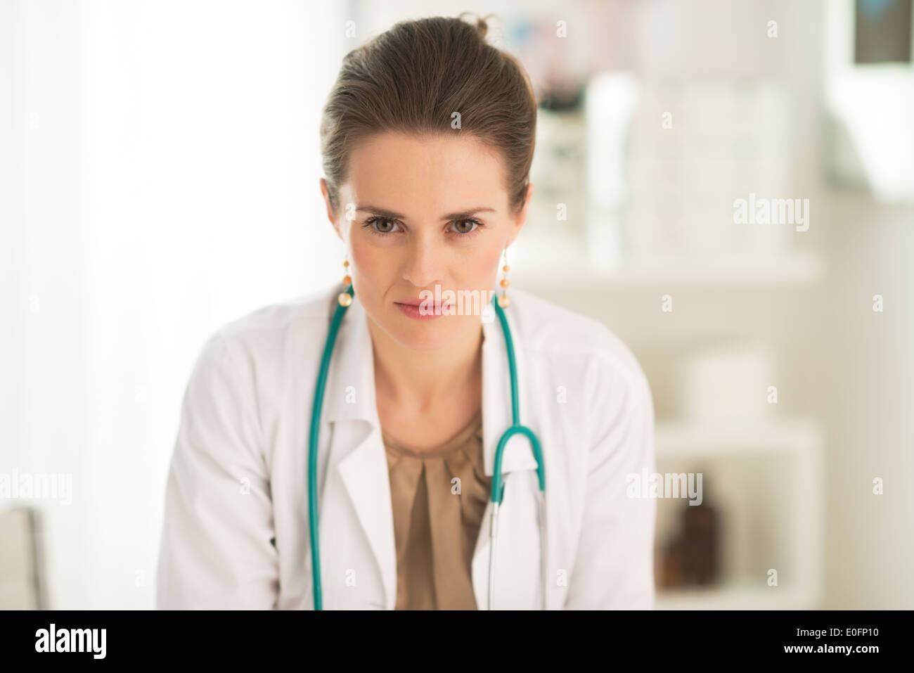 Portrait of serious medical doctor woman Stock Photo - Alamy