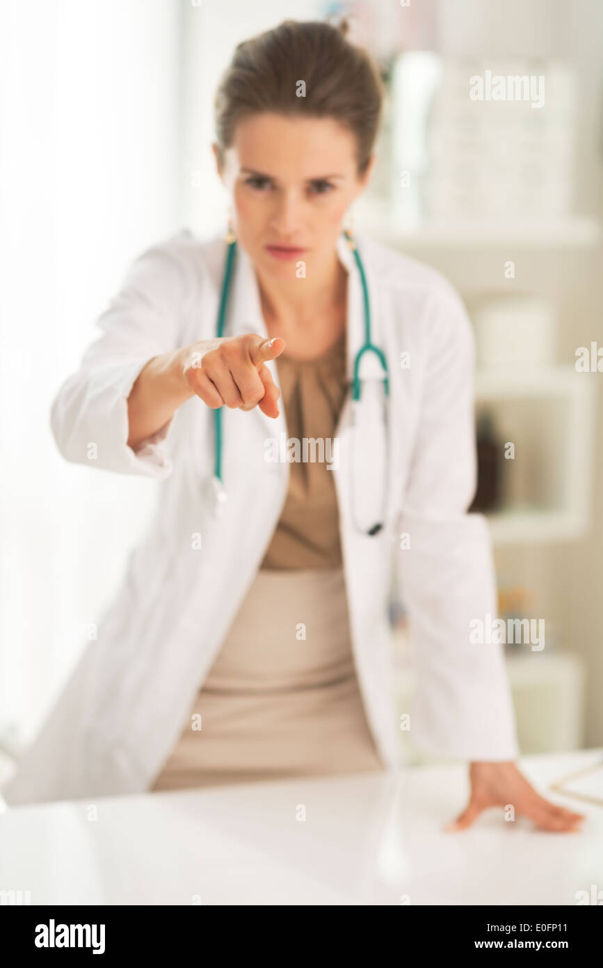 Closeup on medical doctor woman pointing in camera Stock Photo - Alamy