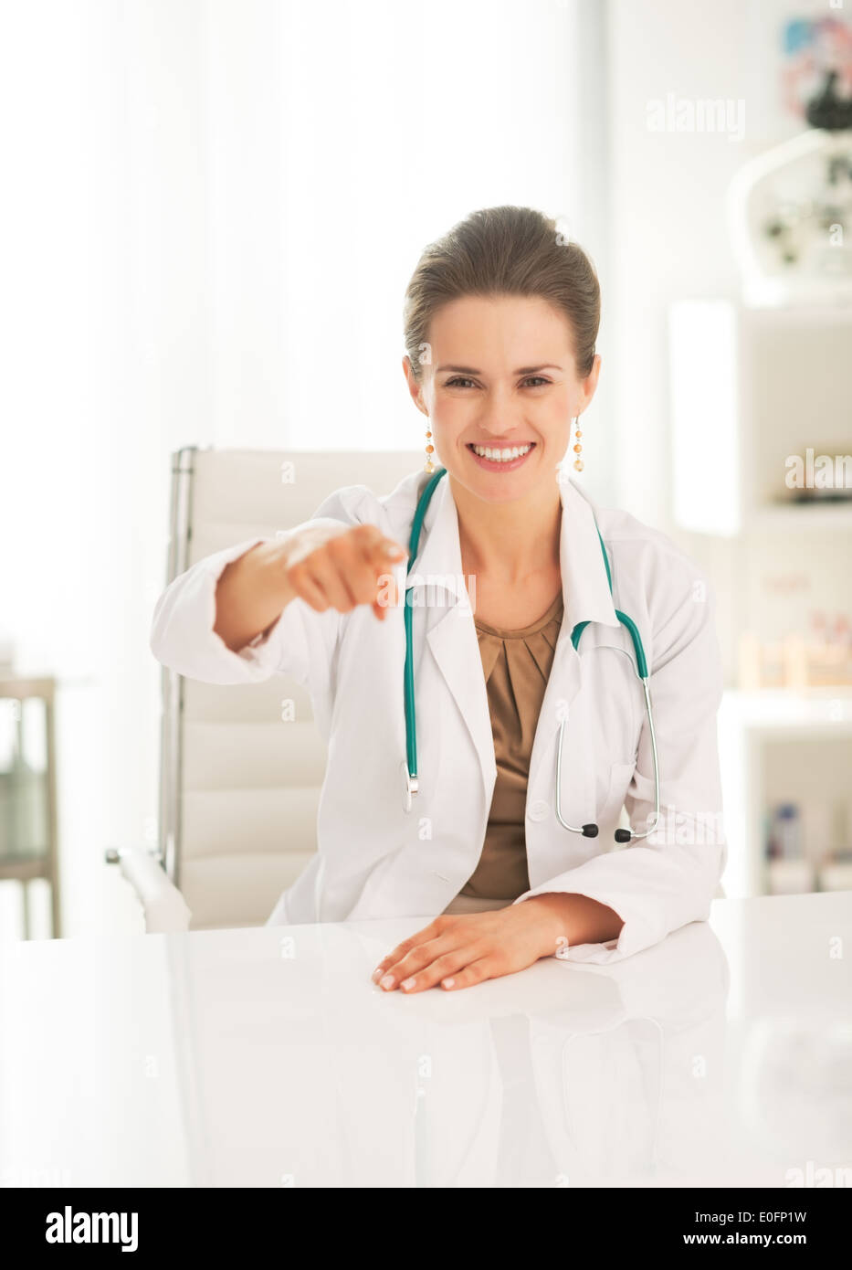 Medical doctor woman pointing in camera Stock Photo - Alamy