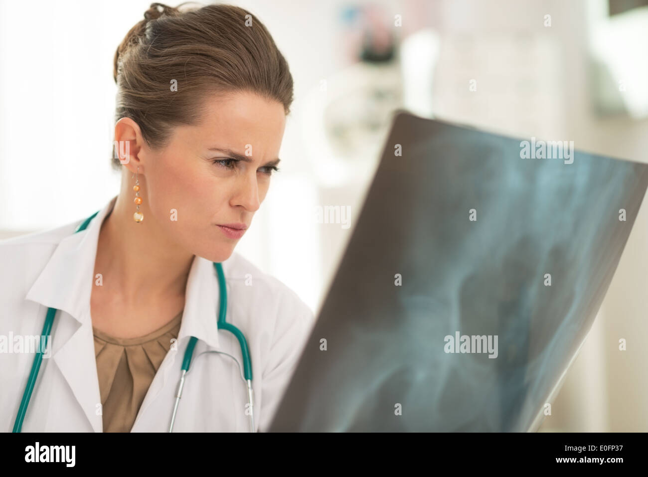 Medical doctor woman looking on fluorography Stock Photo - Alamy