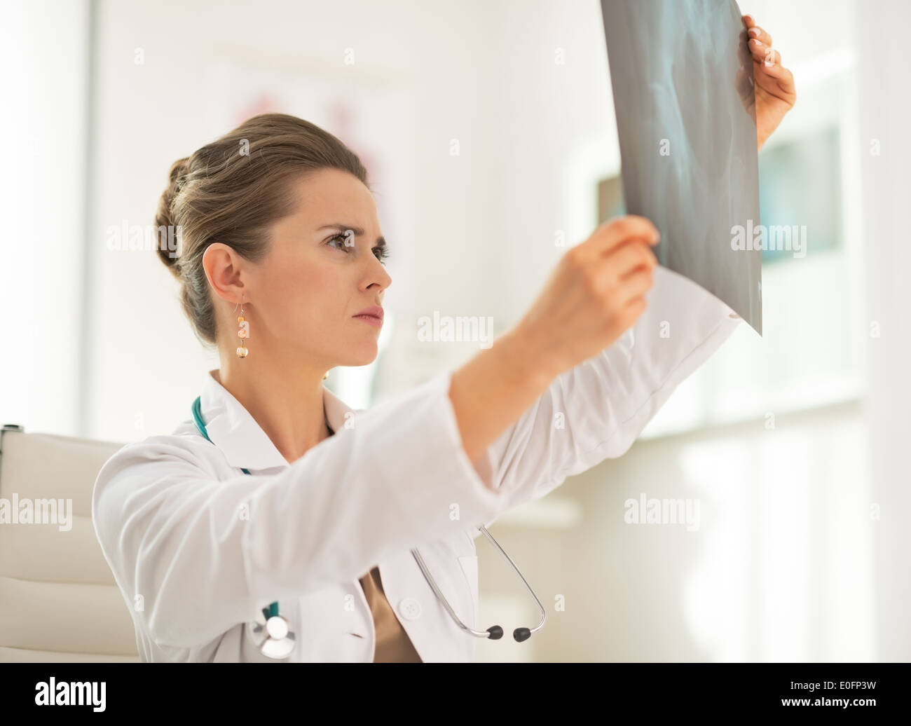 Medical doctor woman looking on fluorography Stock Photo - Alamy