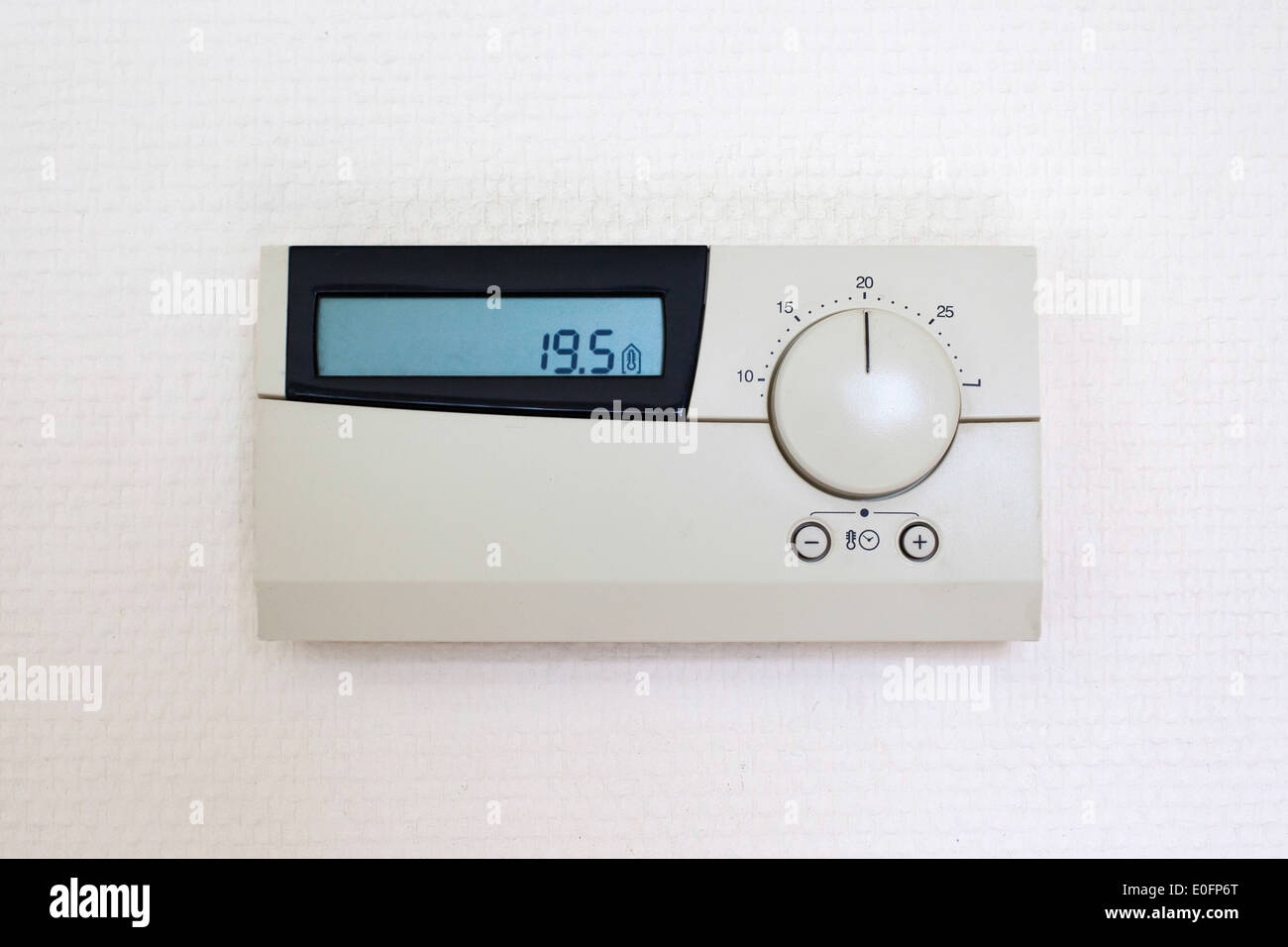 Digital Thermostat set to 19,5 degrees Celsius, isolated on white wall ...