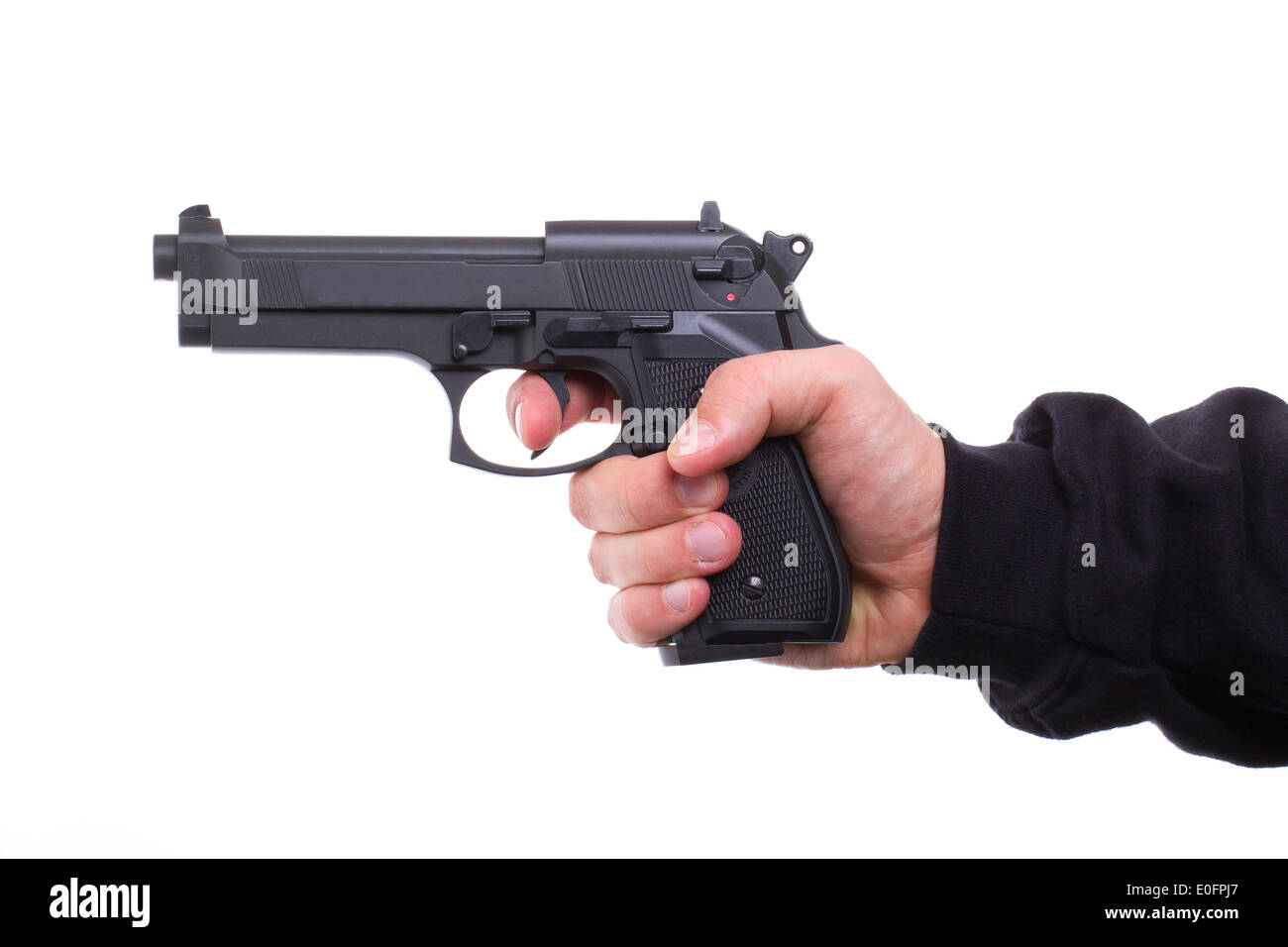 Pistol in hand, isolated on white background Stock Photo - Alamy