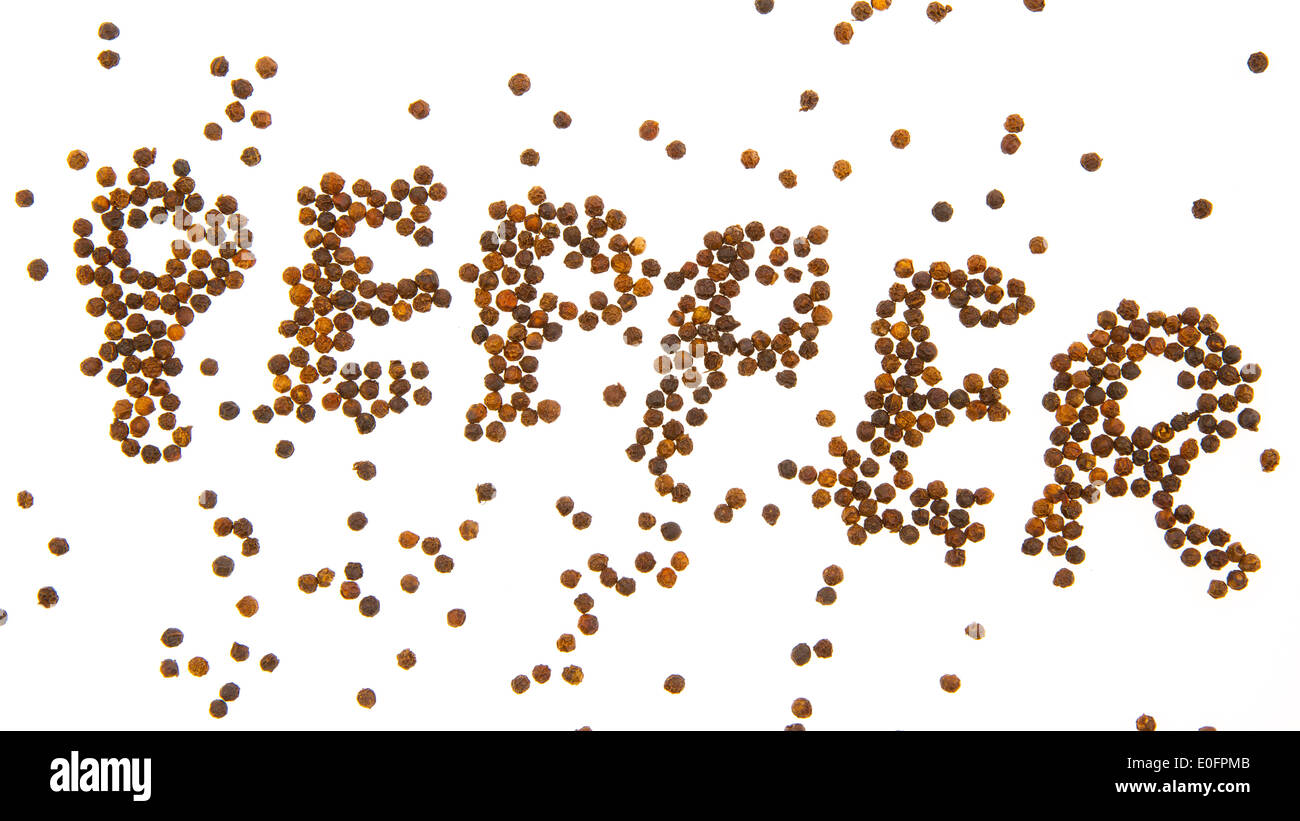 Black pepper spelled out on a white background Stock Photo - Alamy