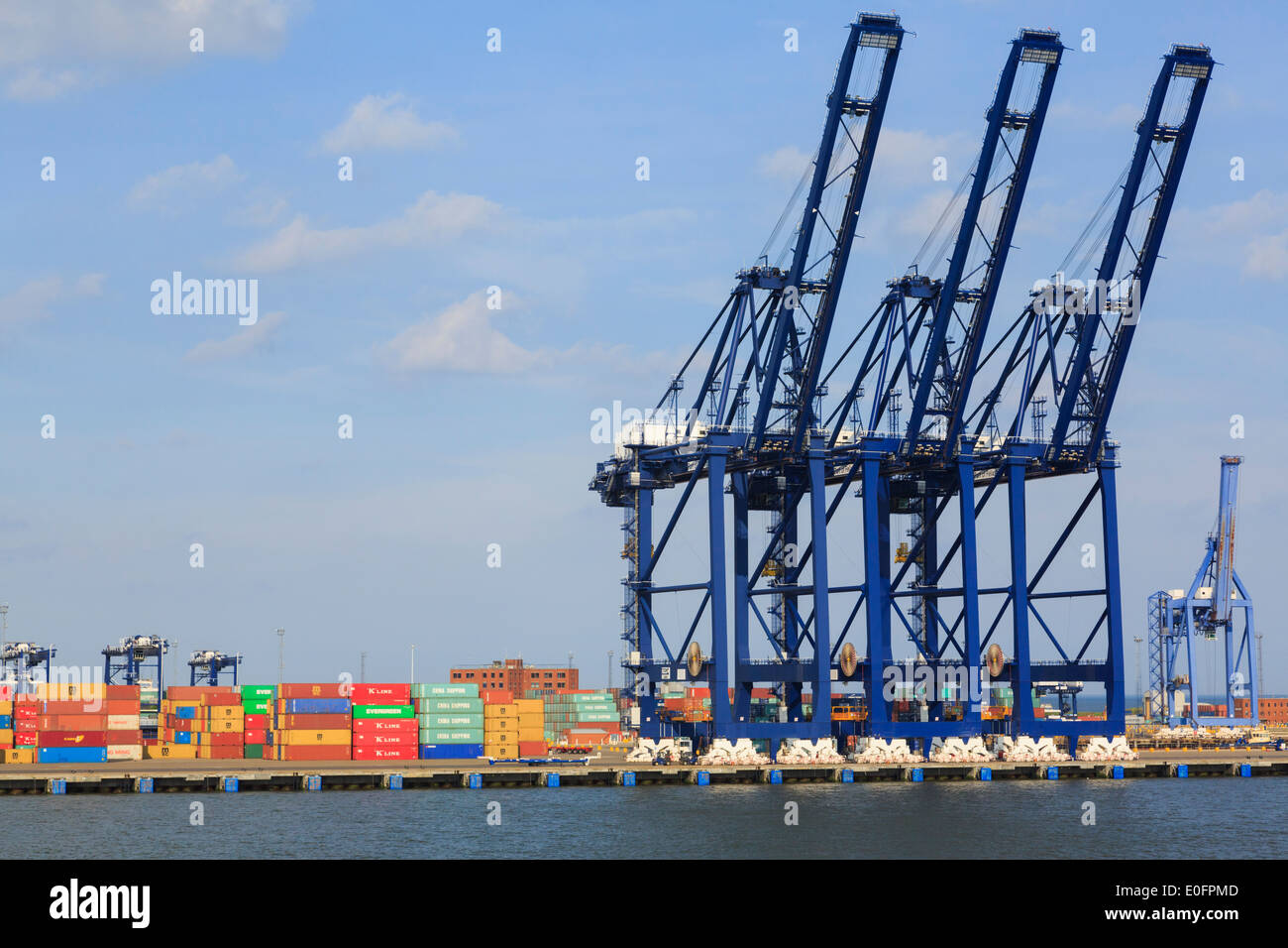 Gantry cranes for lifting containers on dockside terminal quay of ...