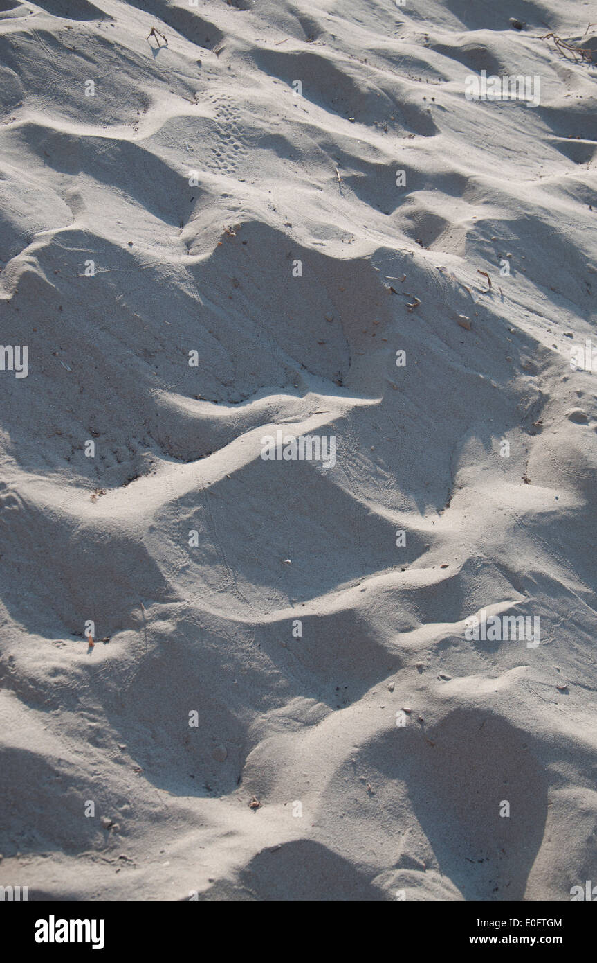 Vertical background with extremely fine white sand with mini dunes and ...