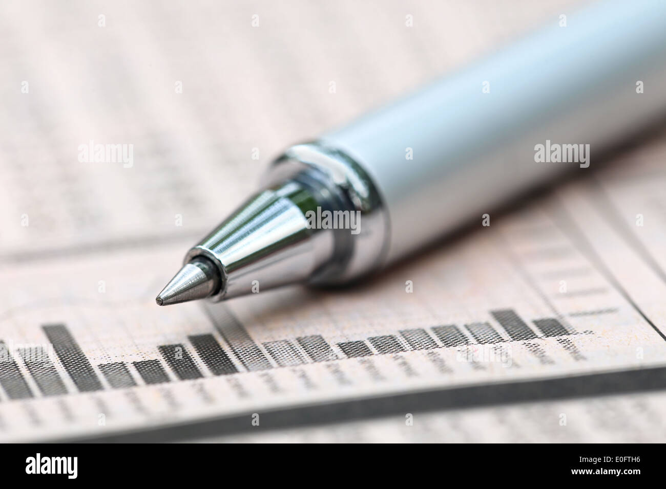 Graph chart with pen on paper Stock Photo - Alamy