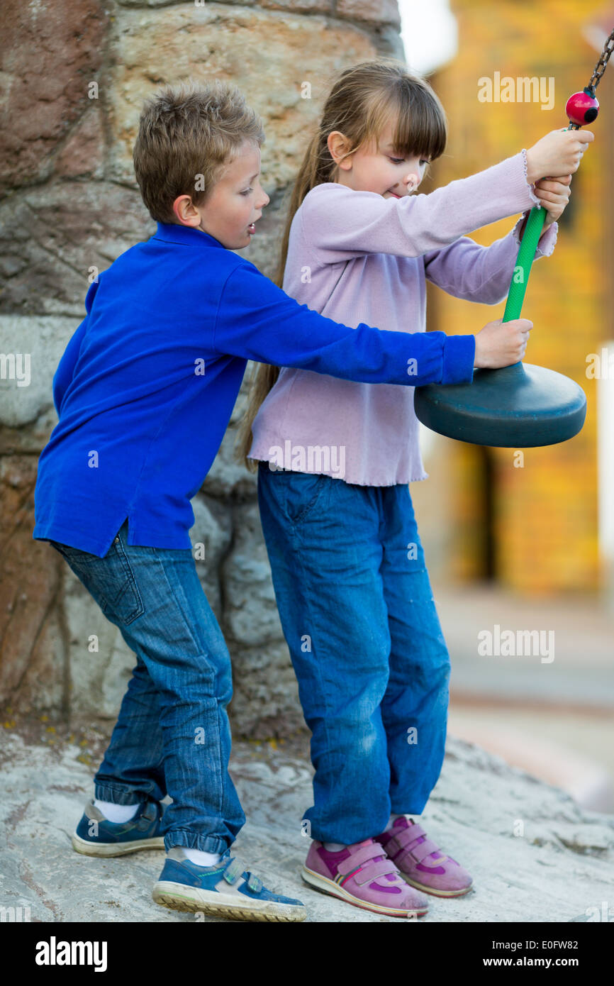 Boy and girl preparing for ride on flying fox Stock Photo - Alamy