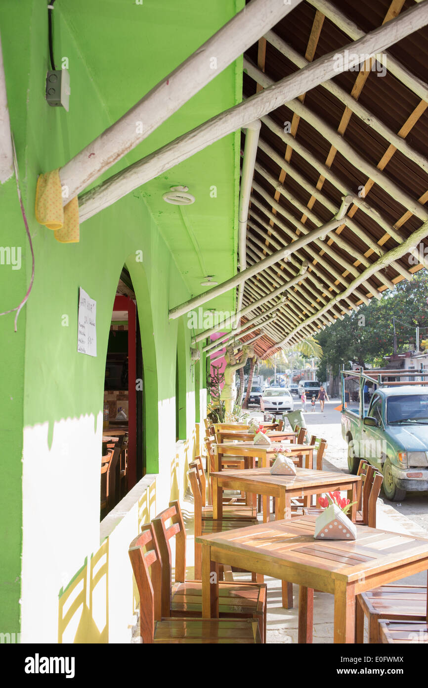 Street side cafe in Tulum town with green exterior Stock Photo - Alamy