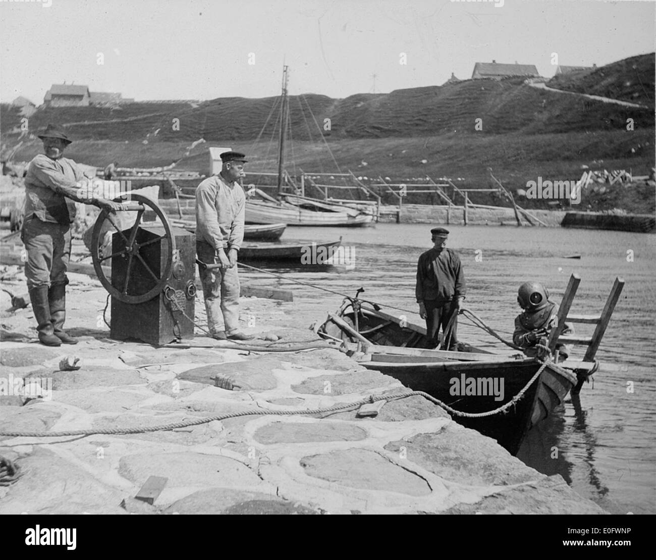 A photograph depicting the early diving apparatus used for underwater ...