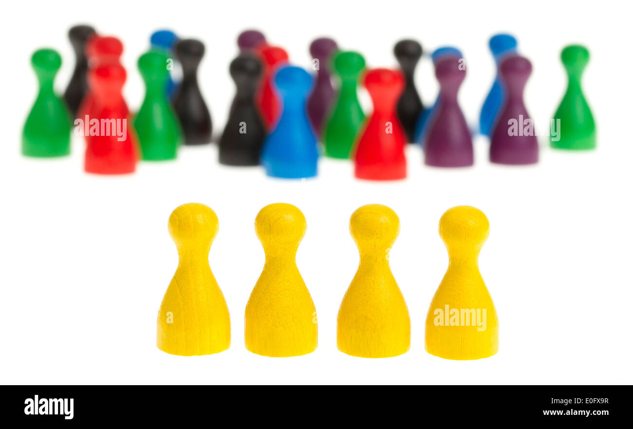 Four yellow pawns in front of a large group of different colored pawns ...