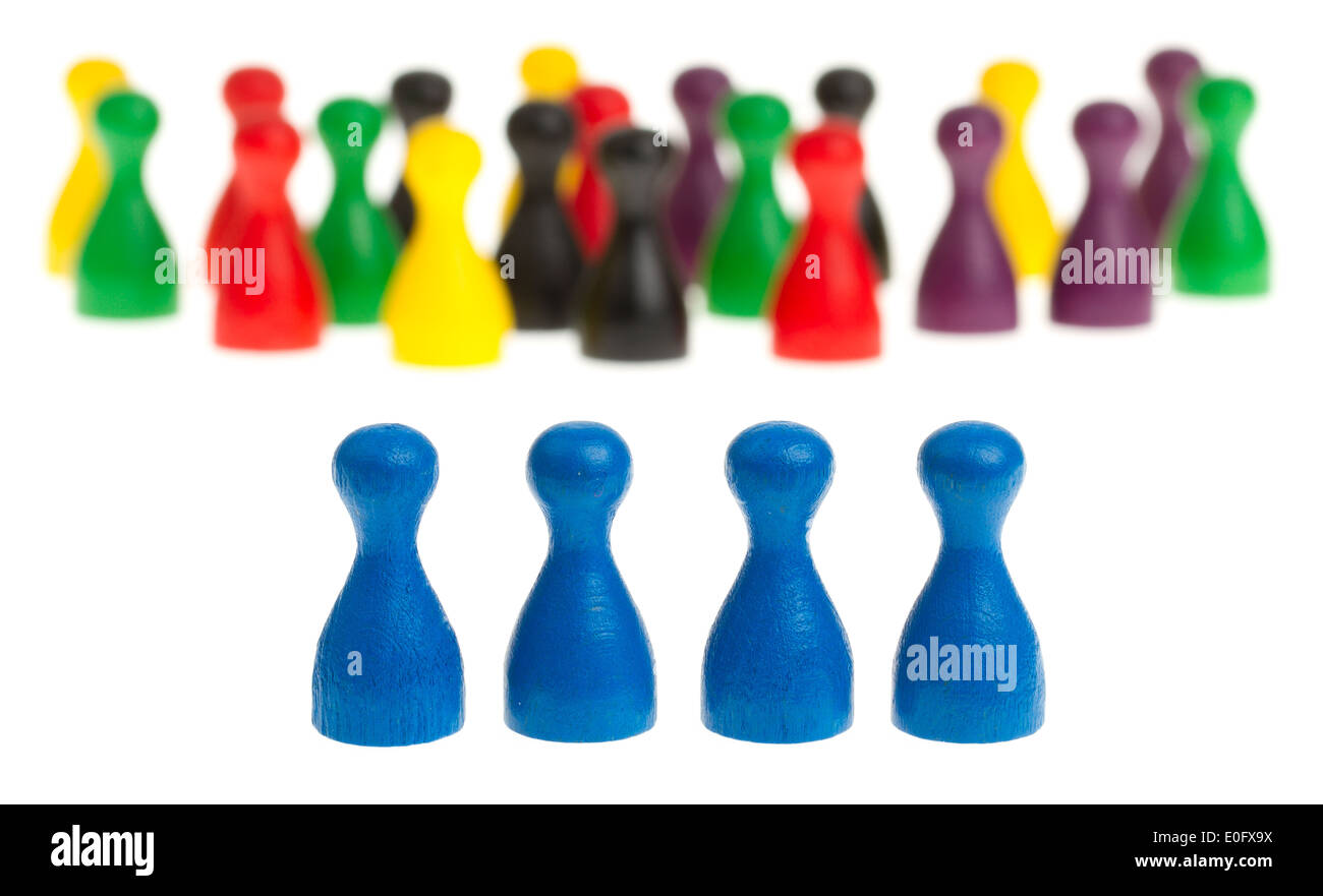 Four blue pawns in front of a large group of different colored pawns ...