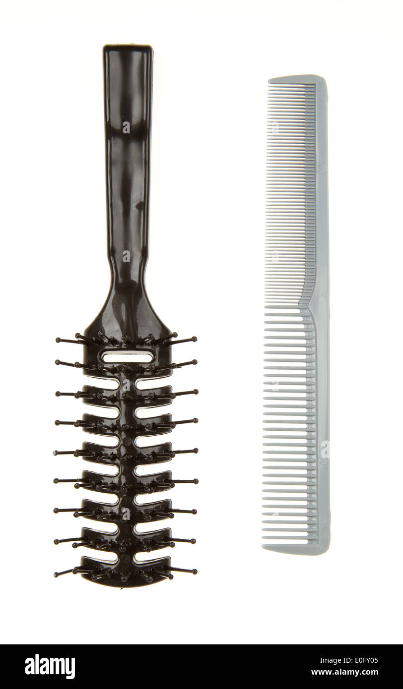 Used black comb and brush isolated on white background Stock Photo - Alamy
