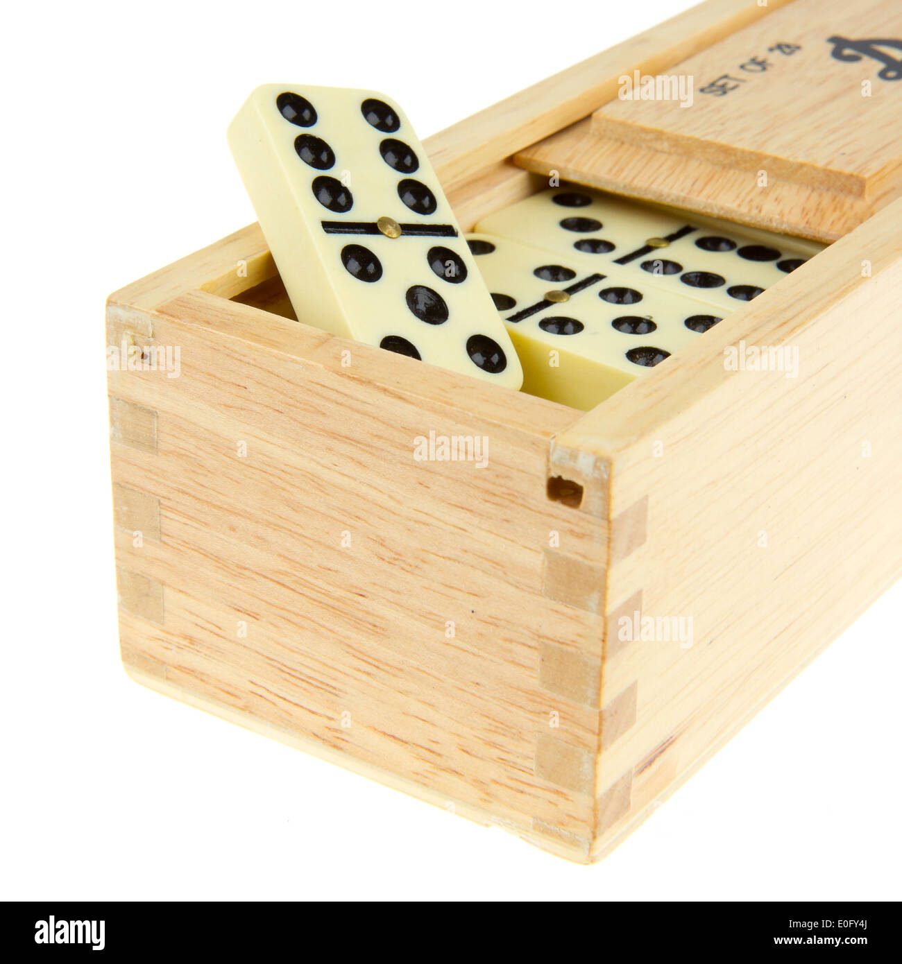 Domino in wooden box against the white background Stock Photo - Alamy