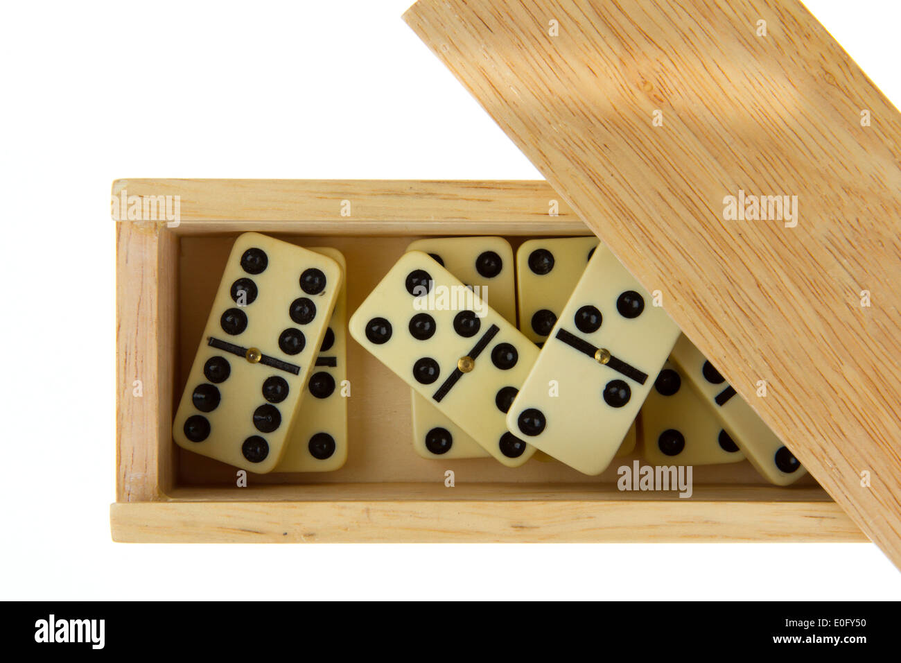 Domino in wooden box against the white background Stock Photo - Alamy