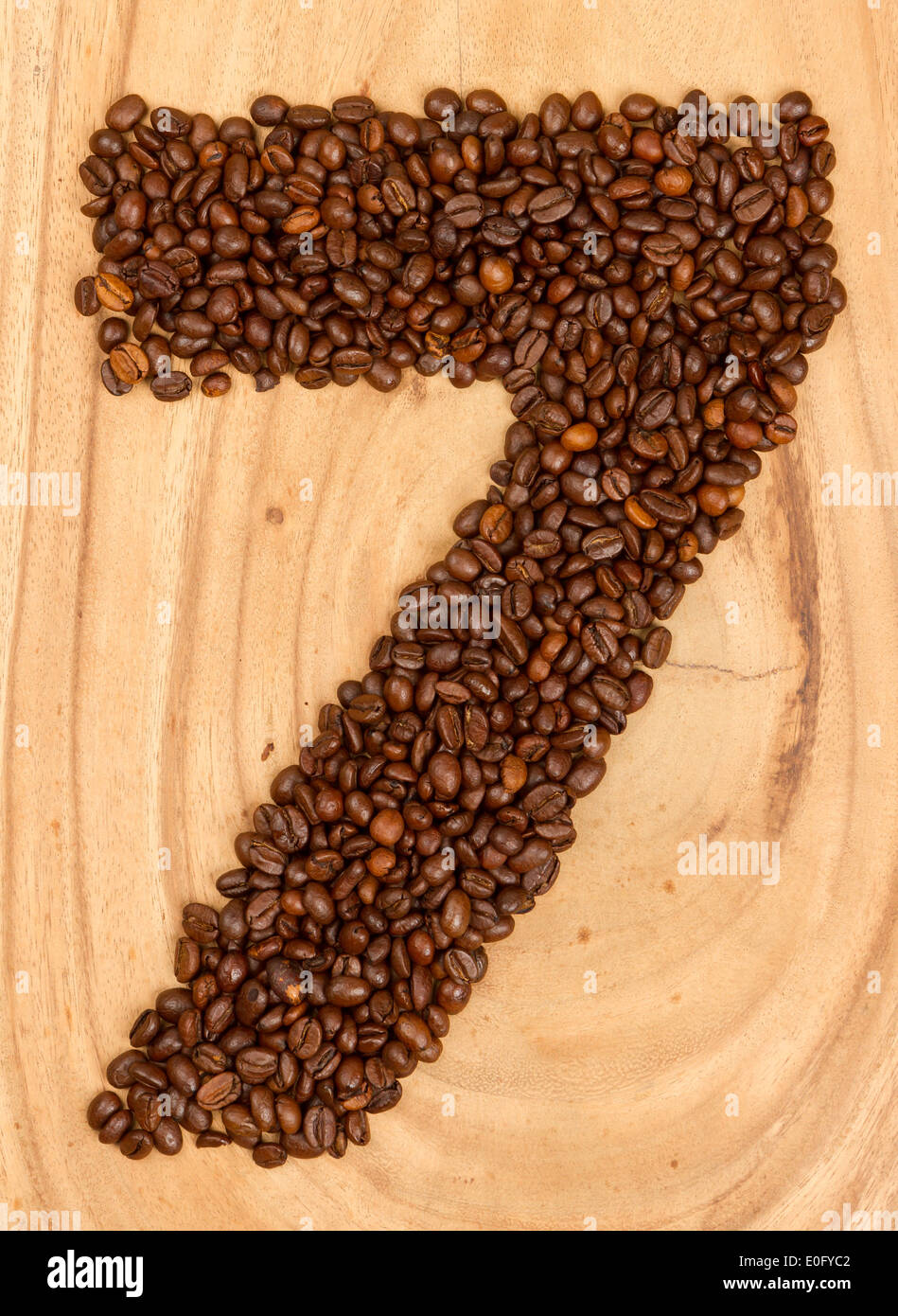 Number from coffee beans, isolated on wood Stock Photo - Alamy