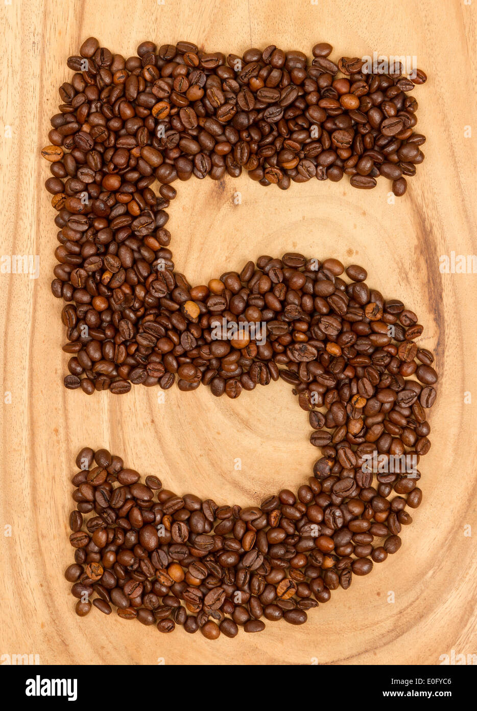 Number from coffee beans, isolated on wood Stock Photo - Alamy