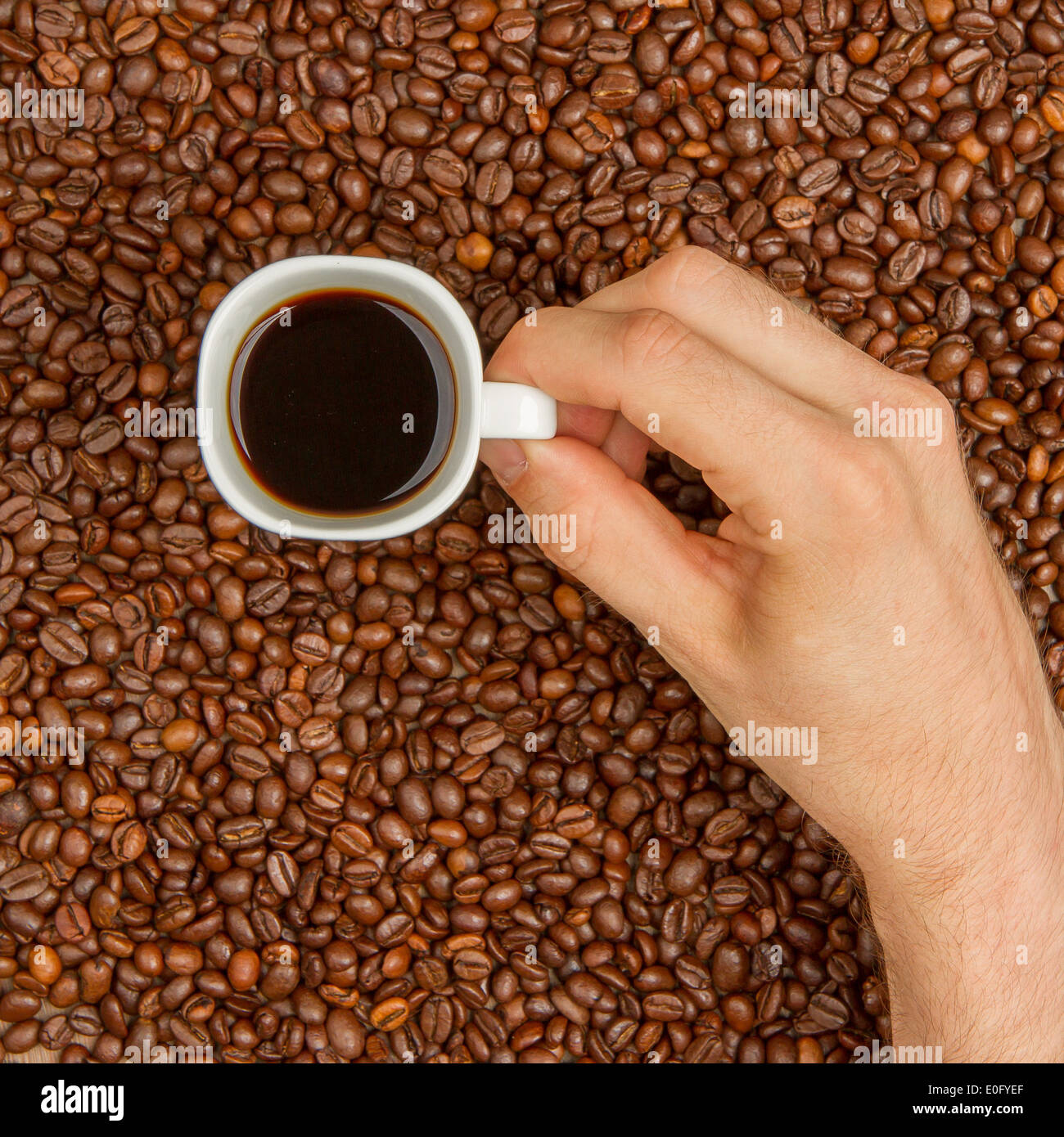 Cup of coffee on aromatic coffee beans. top view Stock Photo - Alamy
