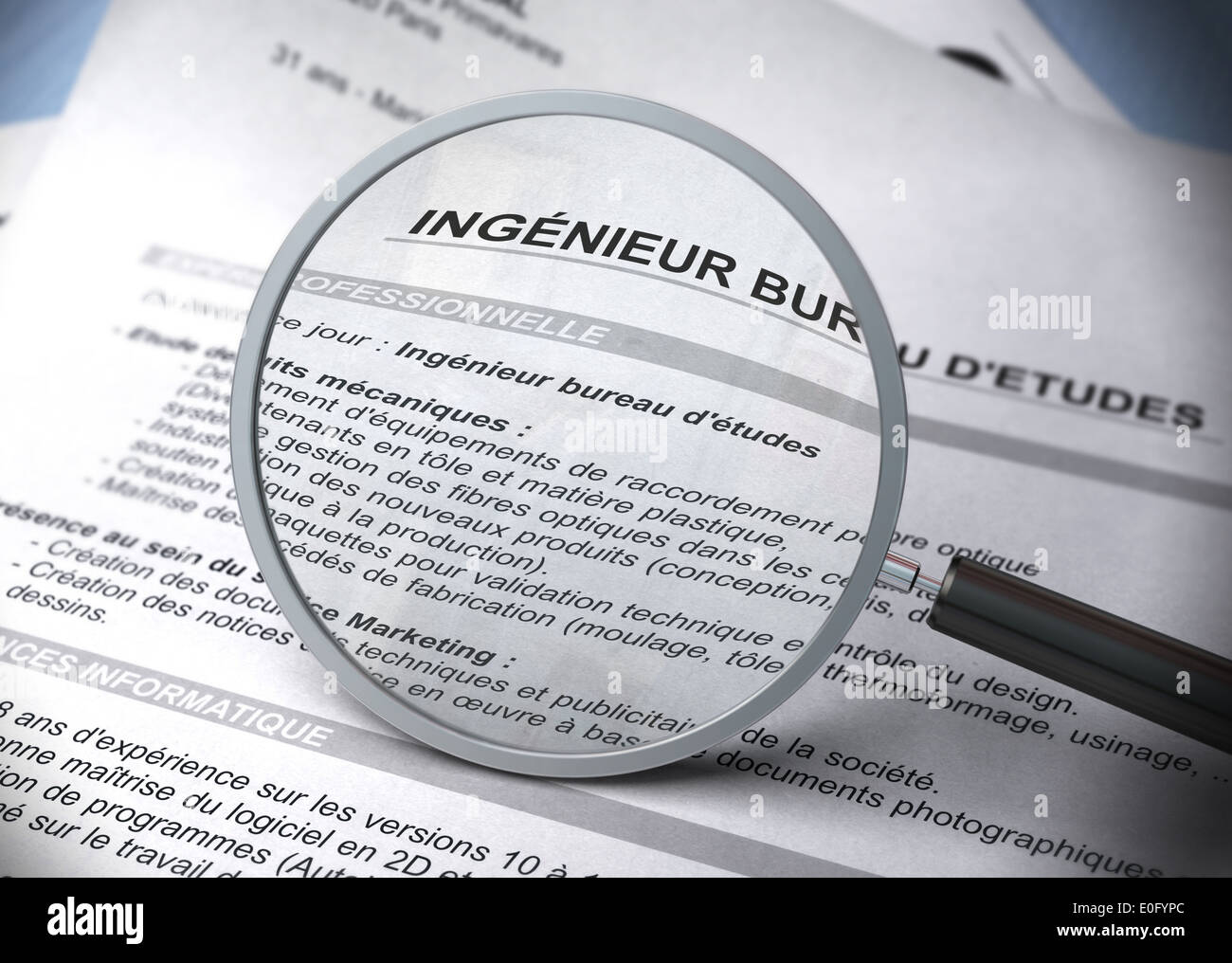 French resume with magnifier and focus on the word engineer, blur ...