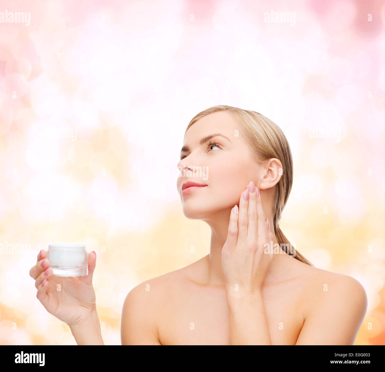 woman applying cream on her skin Stock Photo - Alamy