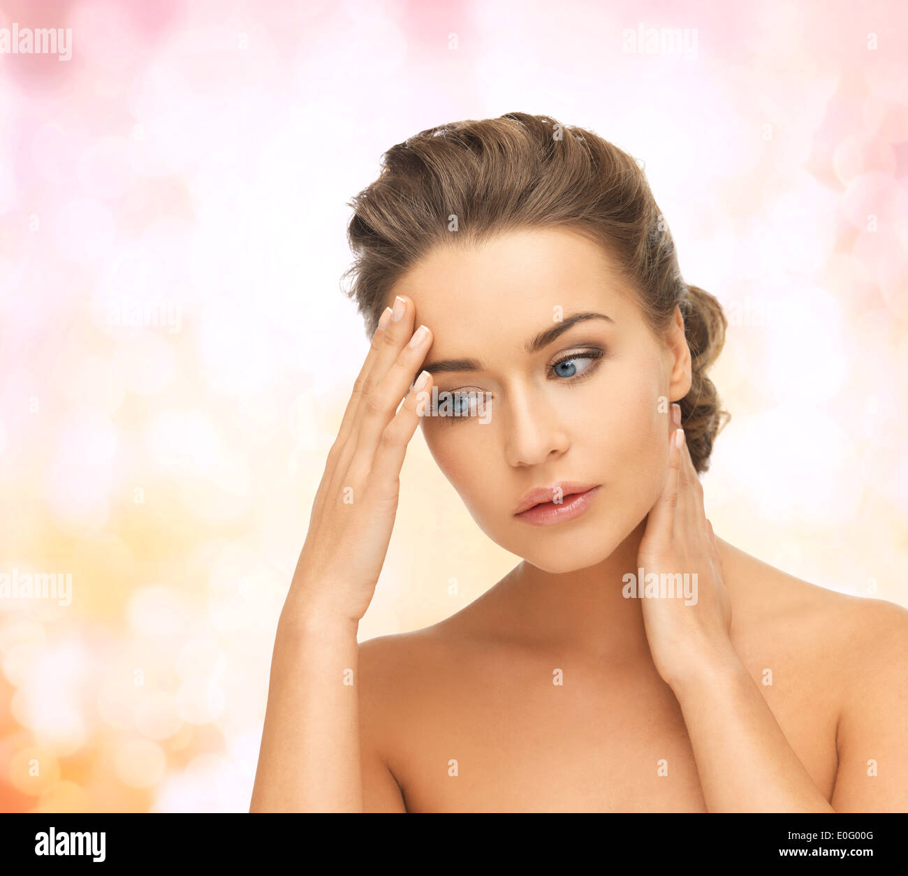 woman holding hands on her neck and forehead Stock Photo - Alamy