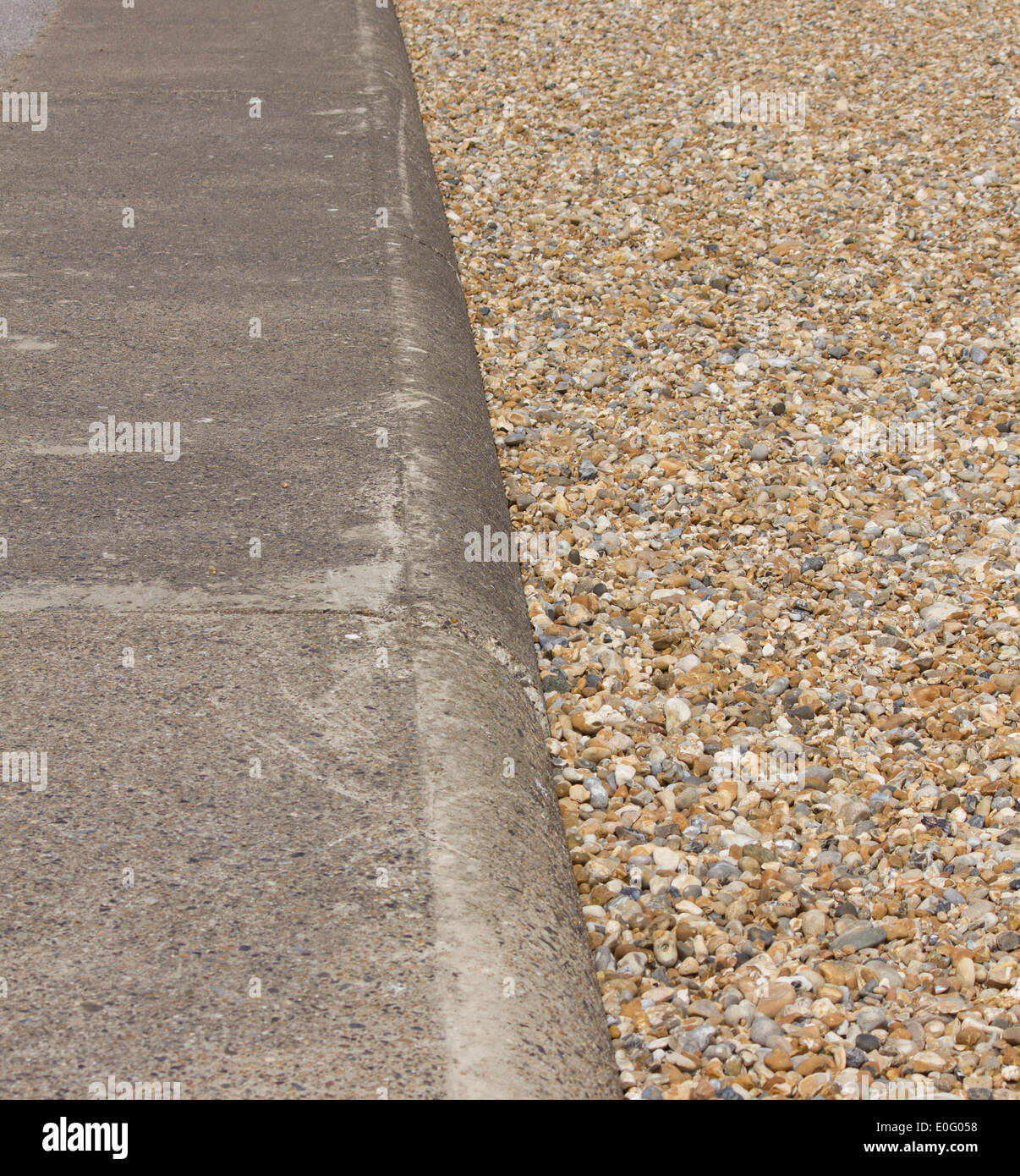 Edging keystones at beach, dividing line of stones and slabs Stock ...