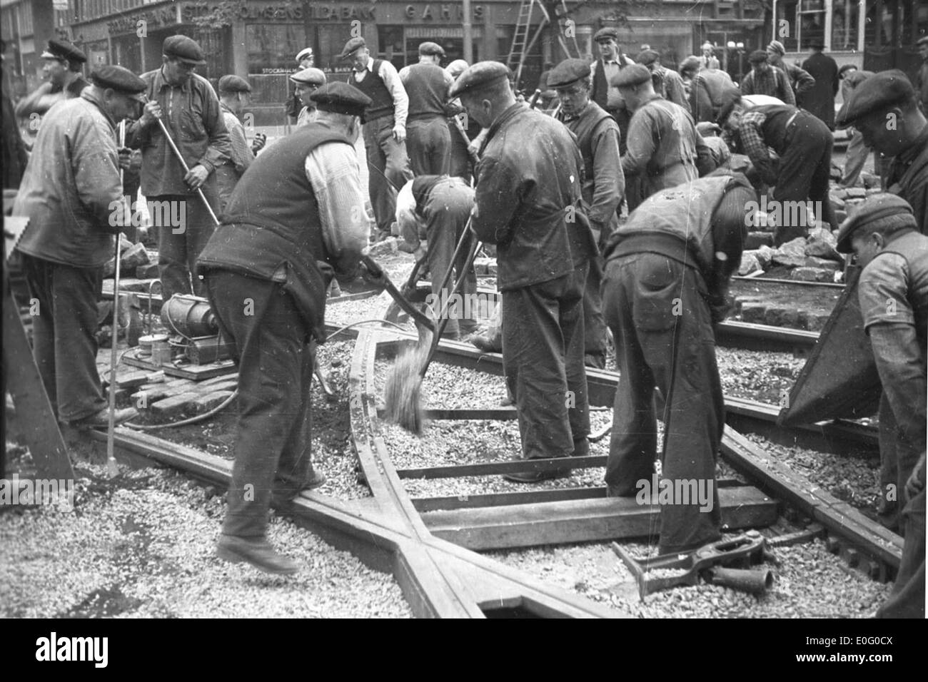 This photograph, taken in 1941, shows workers handling railway tracks ...