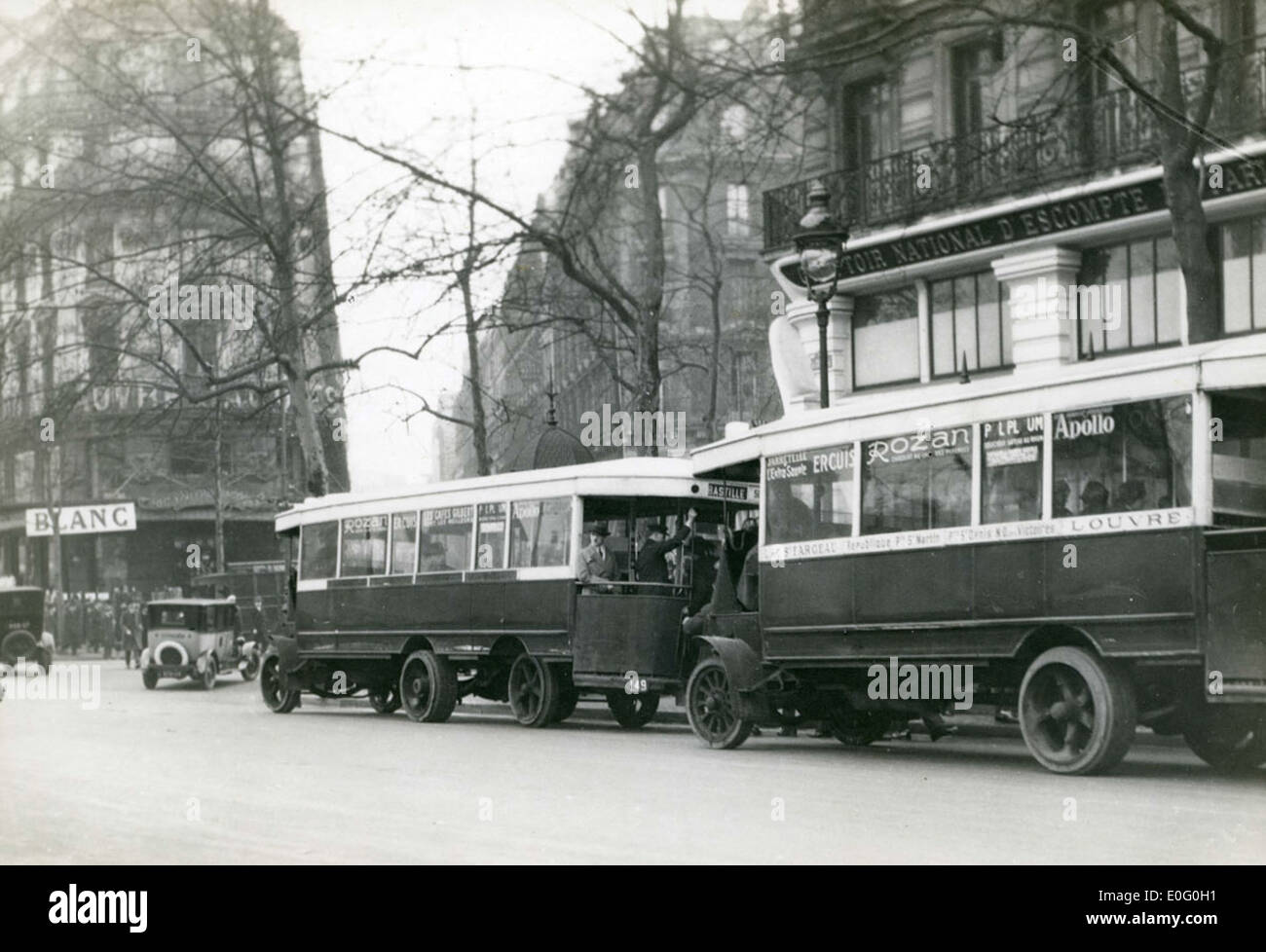 This historical photograph captures street traffic in Paris in 1927 ...