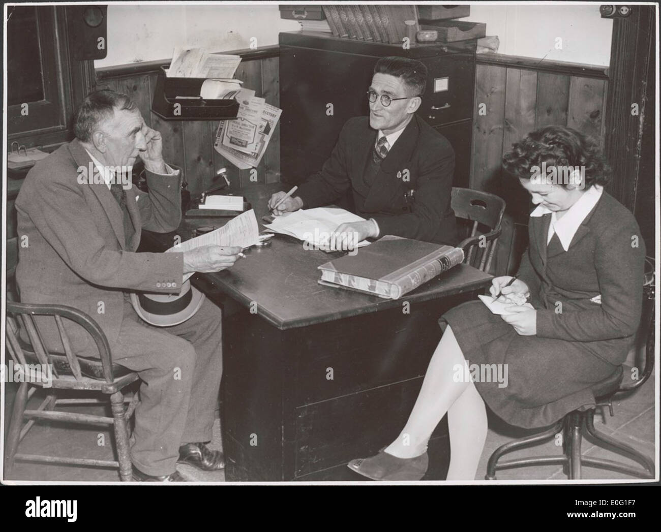 Drouin Shire Secretary Thomas J. Ryan (behind desk) talking to ...