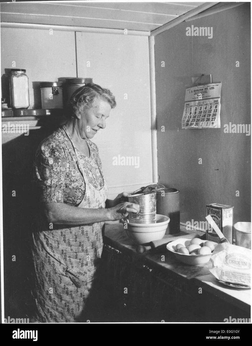 This photograph shows Mrs. Robert Wharton in her kitchen in Drouin ...
