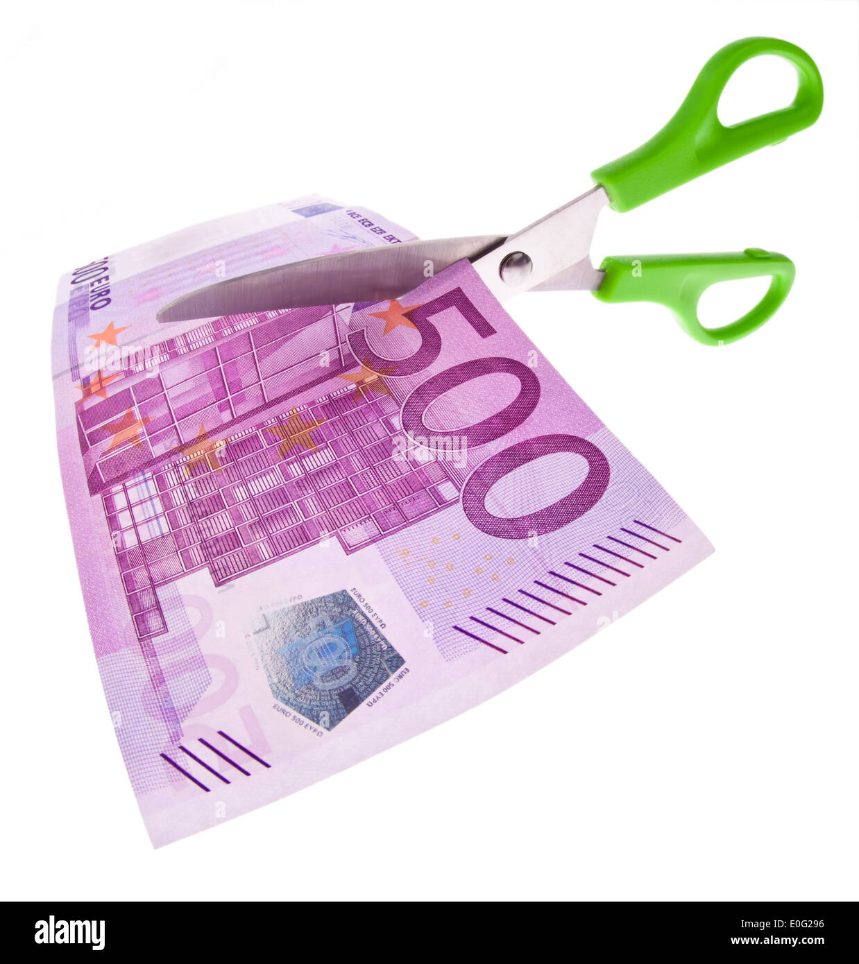 From a euro of bank note a piece is cut off with scissors. Symbol taxes ...